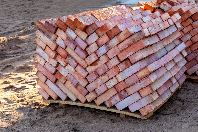 Racks with Full-bodied Bricks. Several Pallets of Red Bricks are ...