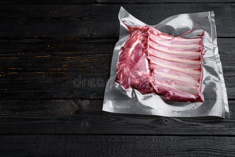 Racks of Lamb Meat Rib Fresh Pack, on Black Wooden Table Background ...