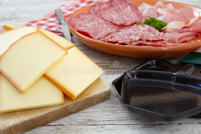 Raclette cheese stock image. Image of cuisine, table - 125504043