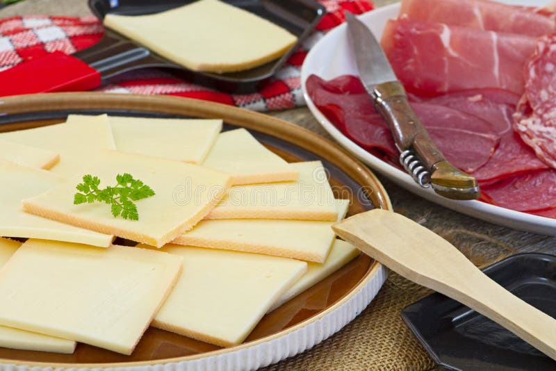 Raclette Cheese and Charcuterie Stock Image - Image of gastronomy ...