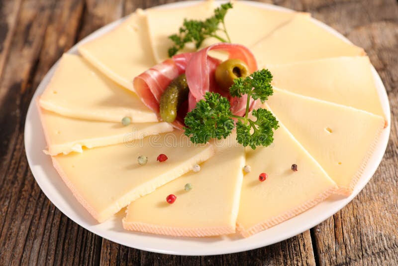 Plate of raclette cheese stock photo. Image of gastronomy - 18705300