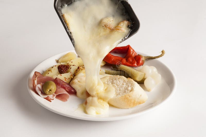 Raclette cheese on a plate stock photo. Image of raclette - 70772878