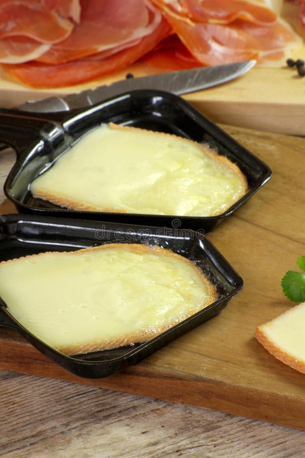 Raclette Cheese Slices and Cold Cuts Stock Photo - Image of cold, cuts ...