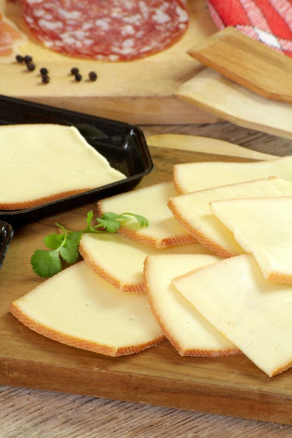 Raclette Cheese Slices and Cold Cuts Stock Image - Image of cutting ...