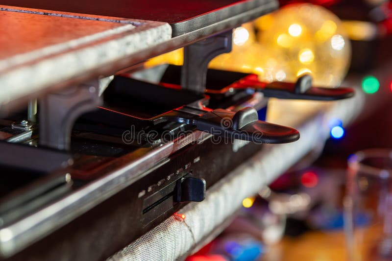 A Raclette Machine with a Colourful Background Stock Photo - Image of ...
