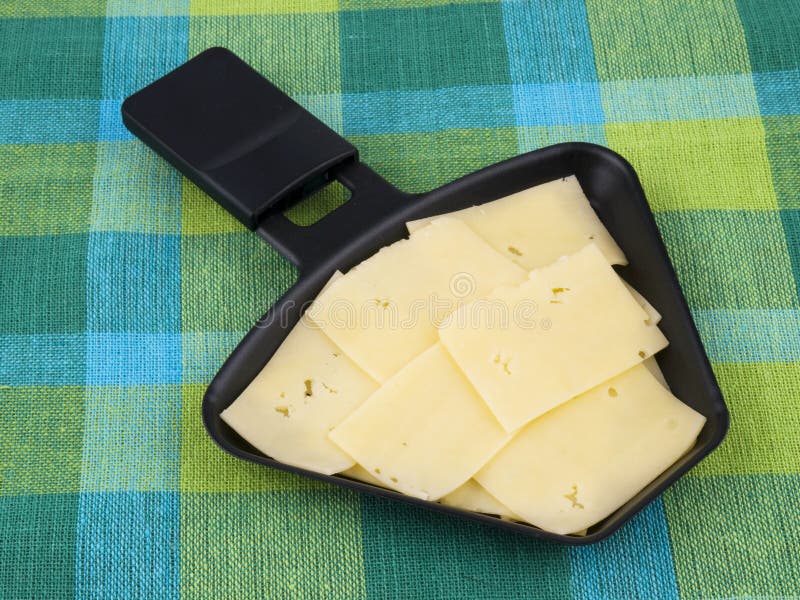 Raclette pan with cheese stock image. Image of tasty - 18675719