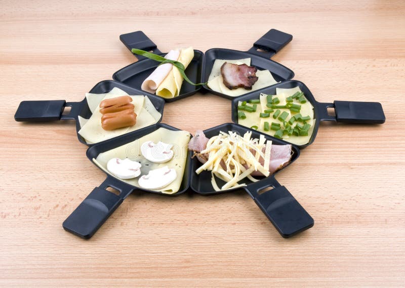 Raclette Pans with Food, Ideal for Party Stock Photo - Image of melting ...