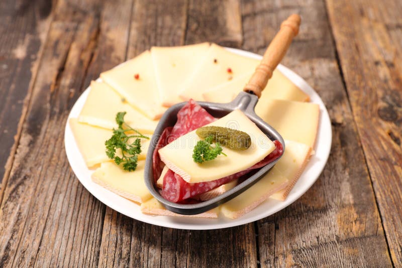 Plate of raclette cheese stock photo. Image of gastronomy - 18705300