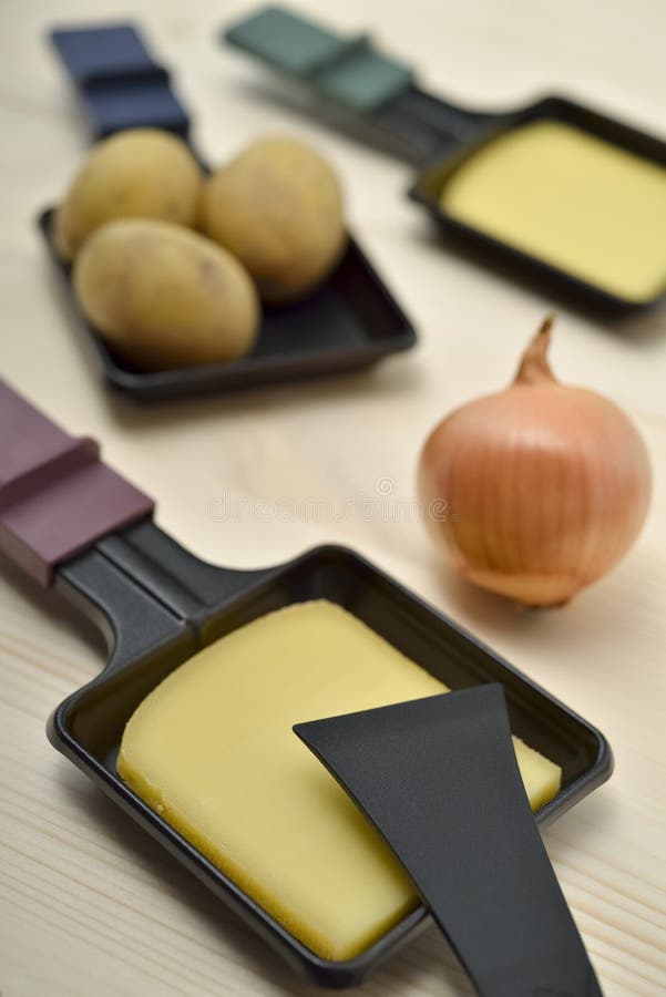 Raclette Trays with Chessee, Onion and Potatoes Stock Image - Image of ...