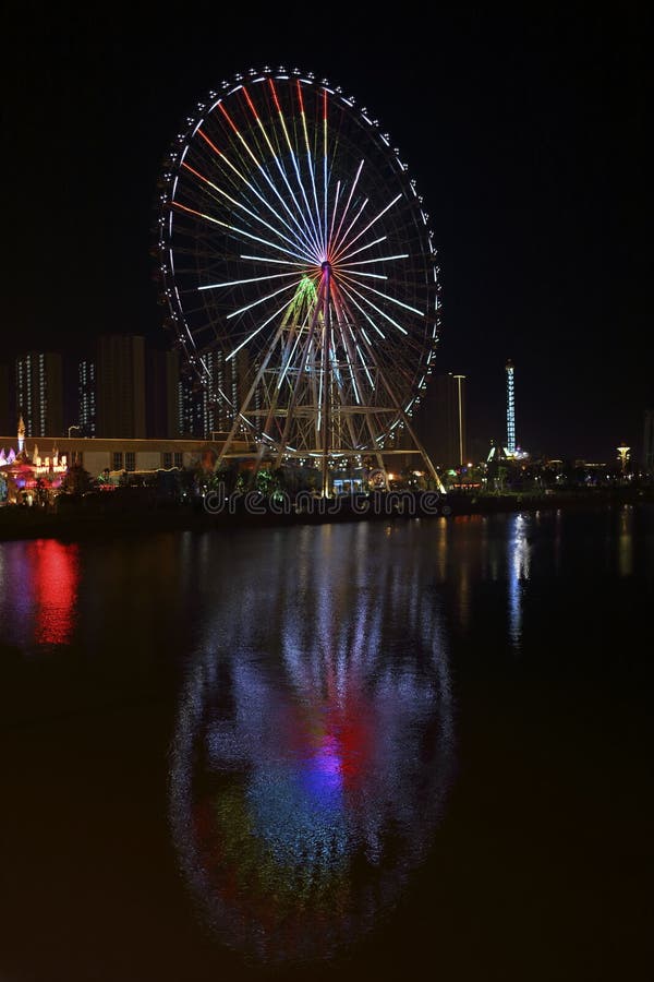 Radial Lights in the Big Wheels, beside the River at Night Stock Image ...
