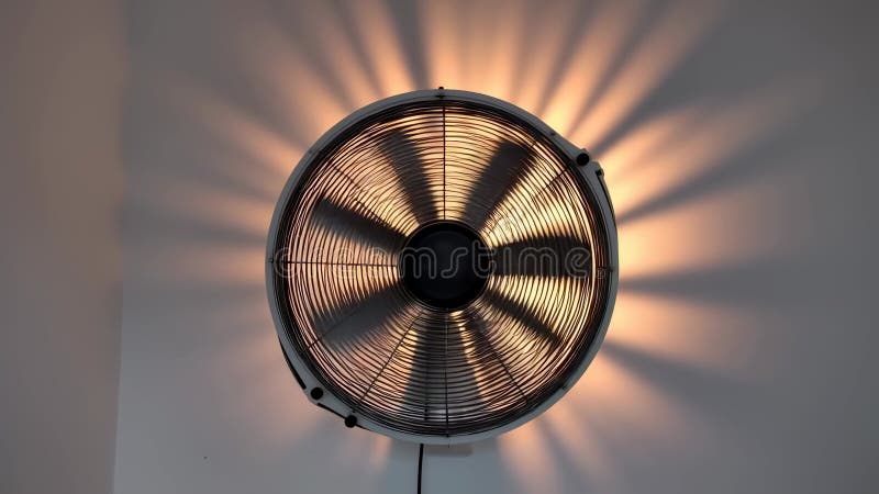 Radiant Ceiling Fan Casting Dynamic Light Patterns in Motion Stock ...