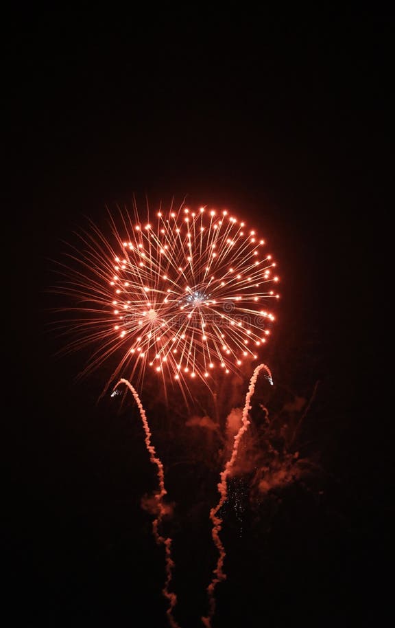 Radiant Night Sky Illuminated by Cascading Exploding Red Fireworks ...