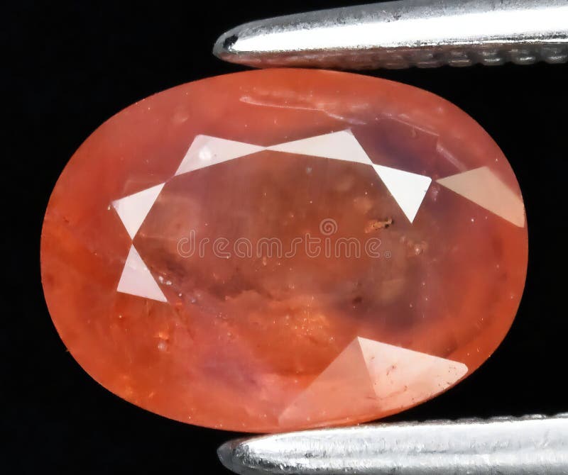 Radiant Orange Gemstone Glimmering Under Soft Light Stock Image - Image ...
