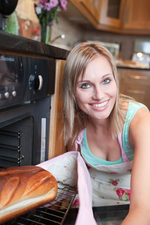 Radiant woman baking bread stock photo. Image of diet - 13766912