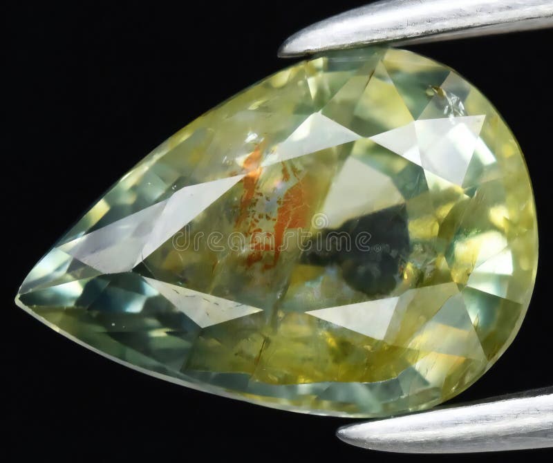 Radiant Yellow-Green Pear-Shaped Gemstone Capturing Light and Intrigue ...