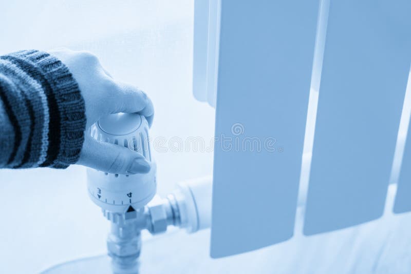 Radiator Adjustment Closeup. Female Hand Adjusting Radiator Temperature ...