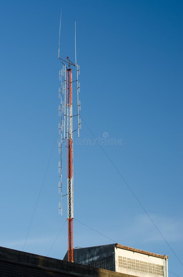 A Radio Communications Tower Against Blue Sky Stock Photo - Image of ...