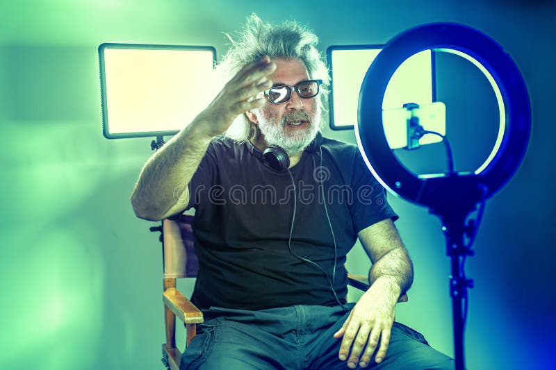 Freaky Man Going Crazy Inside Colored Studio Surrounded Camera Stuff ...