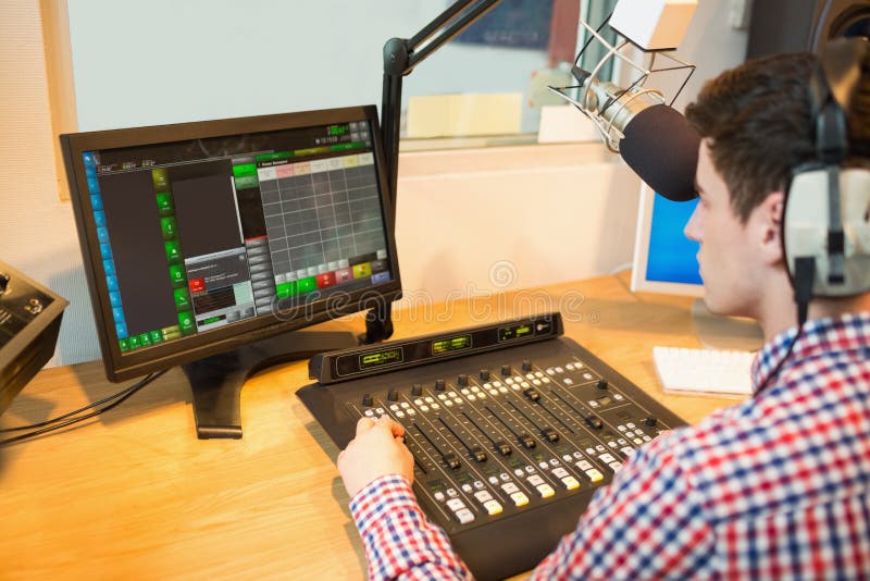 Radio Host Operating Sound Mixer while Looking in Monitor Stock Image ...