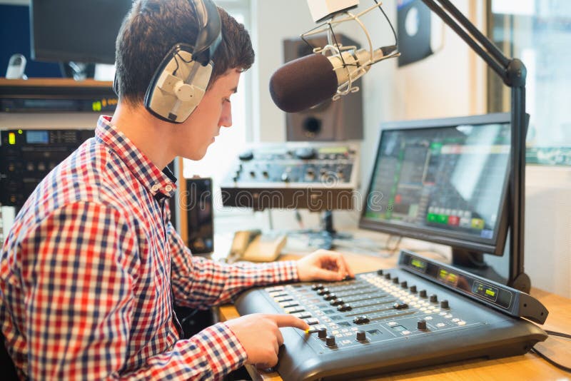 Radio Host Using Sound Mixer in Studio Stock Photo - Image of caucasian ...