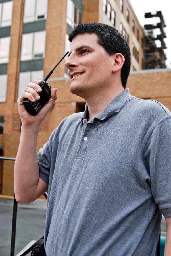 Radio Operator in Front of Building Stock Photo - Image of discussion ...