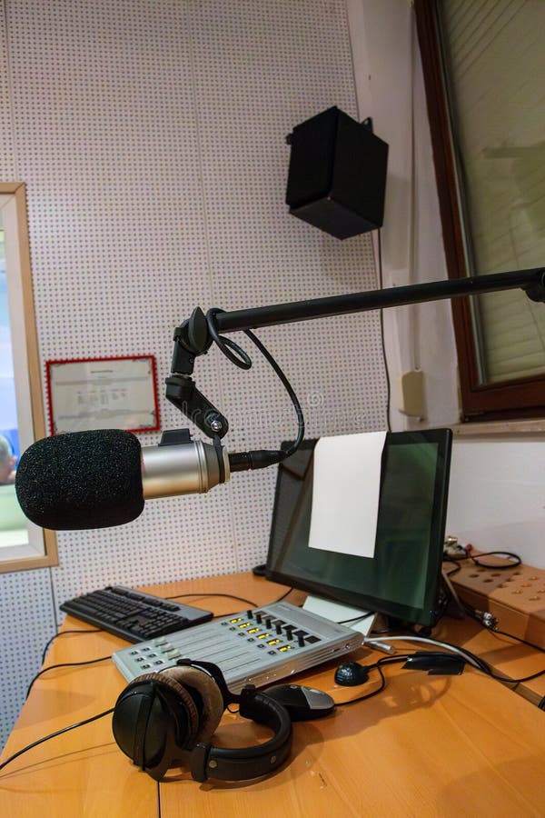 Radio Studio Setup Featuring Microphone, Headphones, and Computer for ...