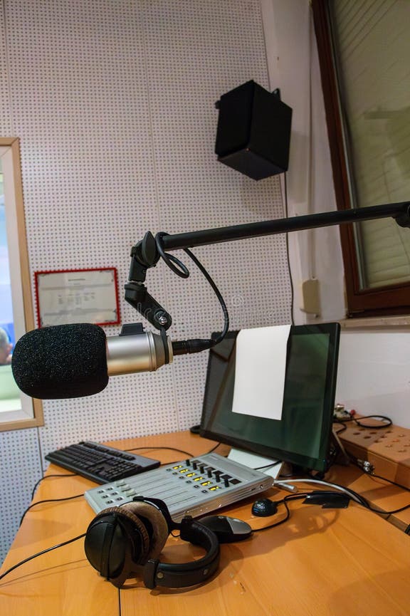 Radio Studio Setup Featuring Microphone, Headphones, and Computer for ...