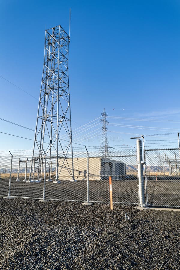 A Radio Tower Behind a Chain-link Fence at an Electrical Substation ...