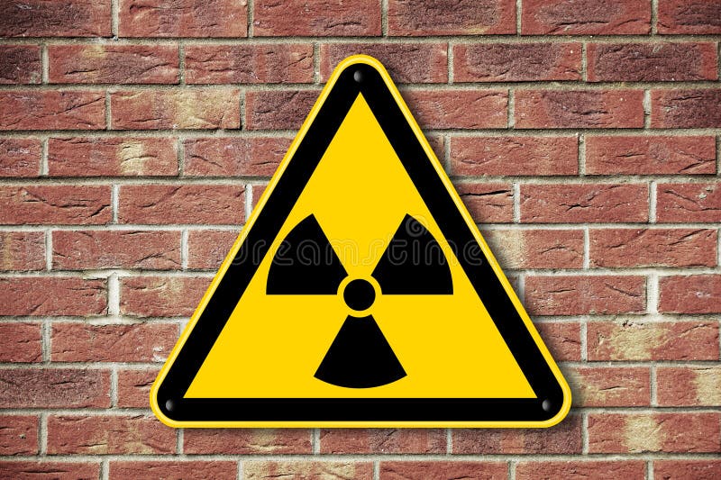 Radioactive Caution Warning Sign on a Brick Wall Background Stock Image ...