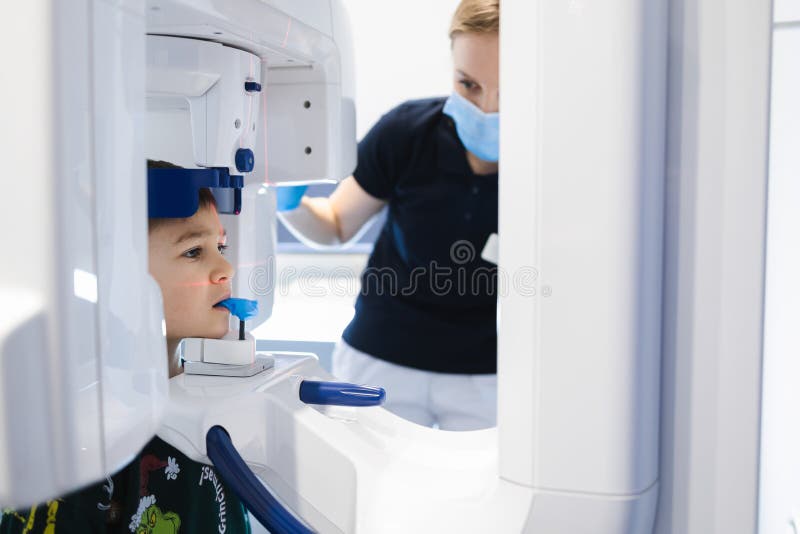 Radiographer Taking Panoramic Teeth Radiography To a Little Boy Using ...