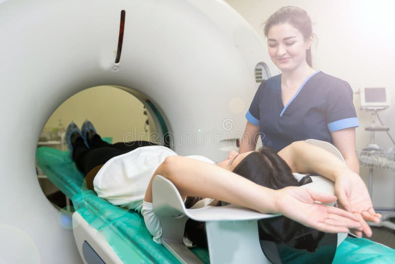 Radiologic Technician and Patient Being Scanned and Diagnosed on ...