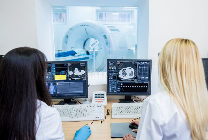 Radiologist and assistant stock image. Image of intern - 22536475