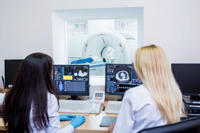 Radiologist and assistant stock image. Image of intern - 22536475