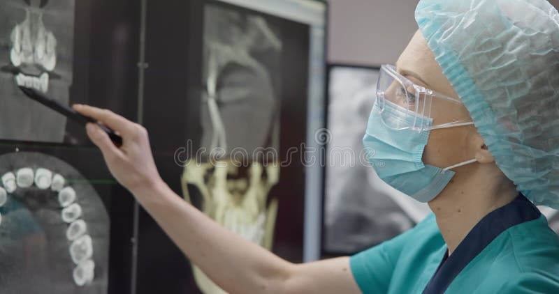 Radiologist Dentist Doctor Looking at Teeth 3D X-ray on Desktop ...