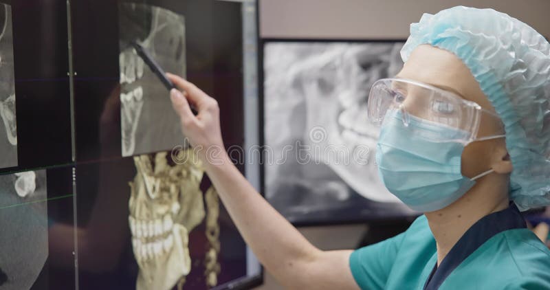 Radiologist Dentist Doctor Looking at Teeth 3D X-ray on Desktop ...