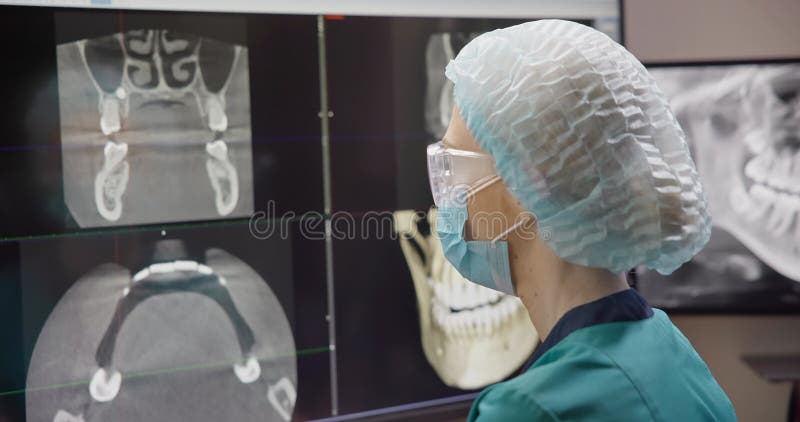 Radiologist Dentist Doctor Looking at Teeth 3D X-ray on Desktop ...