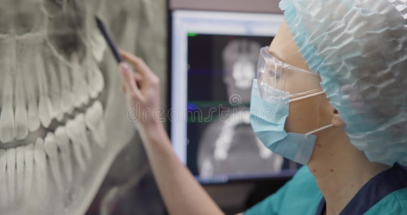Radiologist Dentist Doctor Looking at Teeth 3D X-ray on Desktop ...