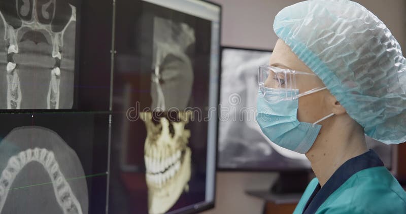 Radiologist Dentist Doctor Looking at Teeth 3D X-ray on Desktop ...