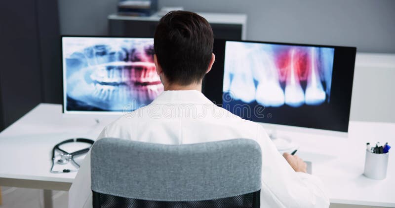 Dentist using desktop pc stock photo. Image of female - 46361308