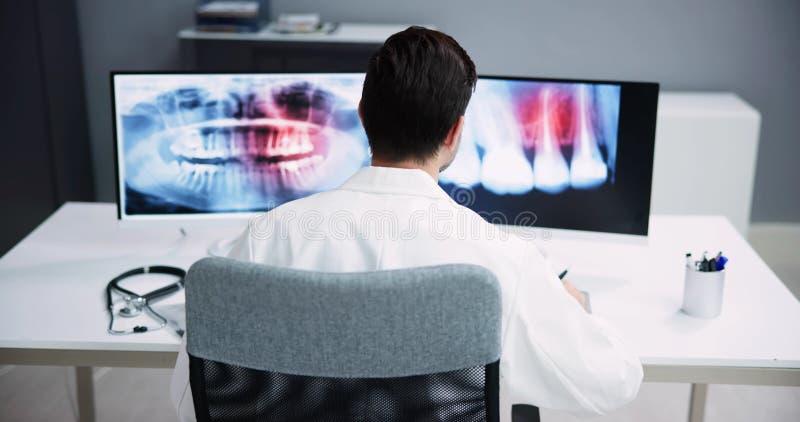 Dentist using desktop pc stock photo. Image of female - 46361308