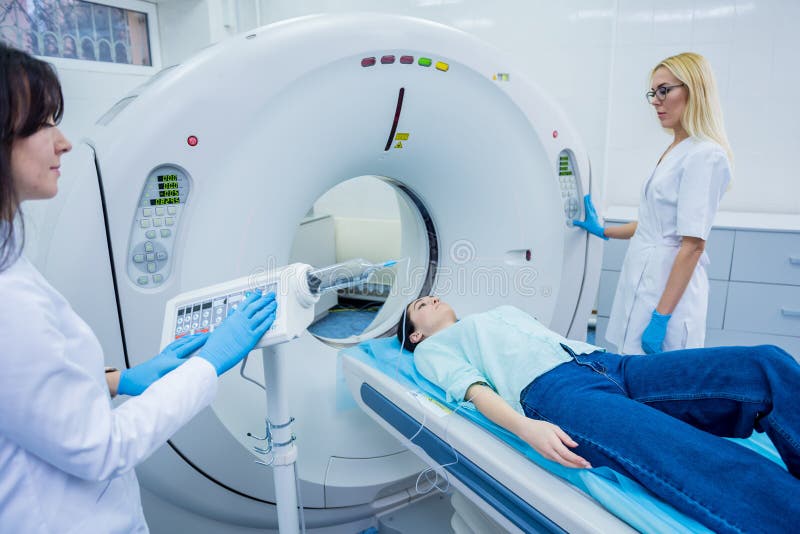Radiologist with a Female Patient in the Room of Computed Tomography ...