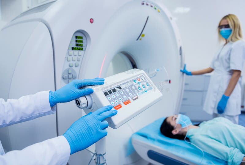 Radiologist with a Female Patient in the Room of Computed Tomography ...