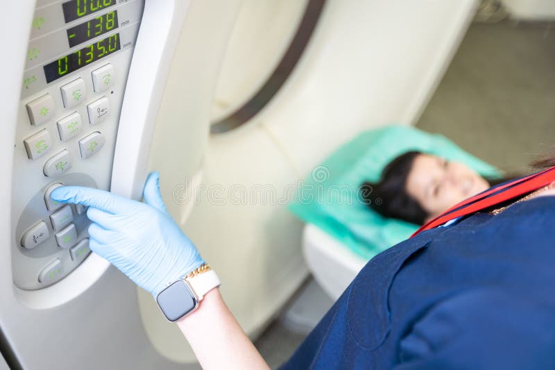 Radiologist with a Female Patient in the Room of Computed Tomography ...
