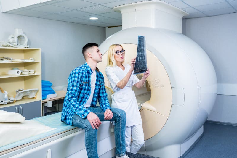 Radiologist with a Male Patient Examining a Mri Scan Stock Image ...