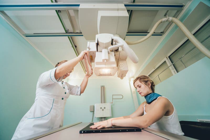 Radiologist and Patient in a X-ray Room. Classic Ceiling-mounted X-ray ...