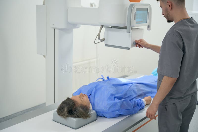 Radiologist Performs a Chest X-ray on an Elderly Patient Stock Photo ...