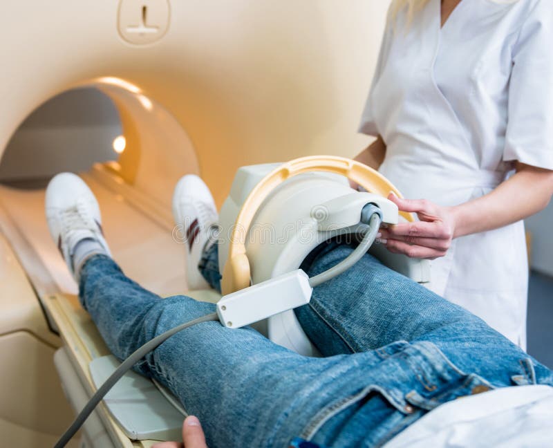 Radiologist Prepares the Patient for an MRI Knee Examination Stock ...
