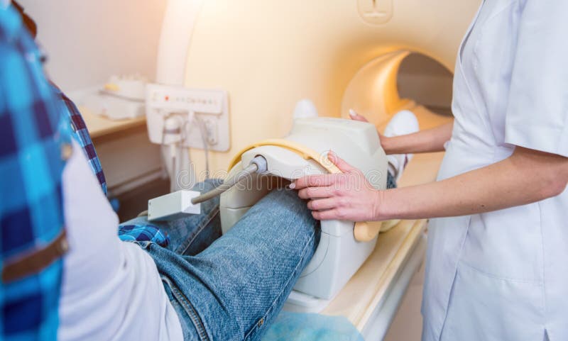 Radiologist Prepares the Patient for an MRI Knee Examination Stock ...