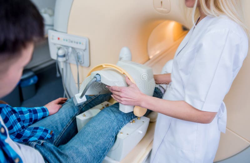 Radiologist Prepares the Patient for an MRI Knee Examination Stock ...