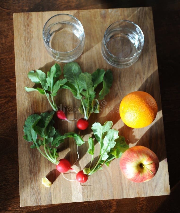 Radish, Orange, Apple, Ginger Root on a Wooden Board Stock Image ...